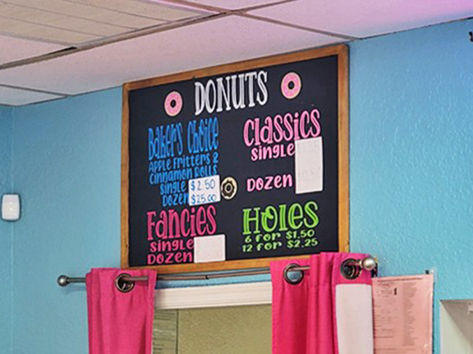 Life's important decisions laid out in colorful chalk: Classics, Baker's Choice, Fancies, or Holes? The Sophie's Choice of breakfast pastries.