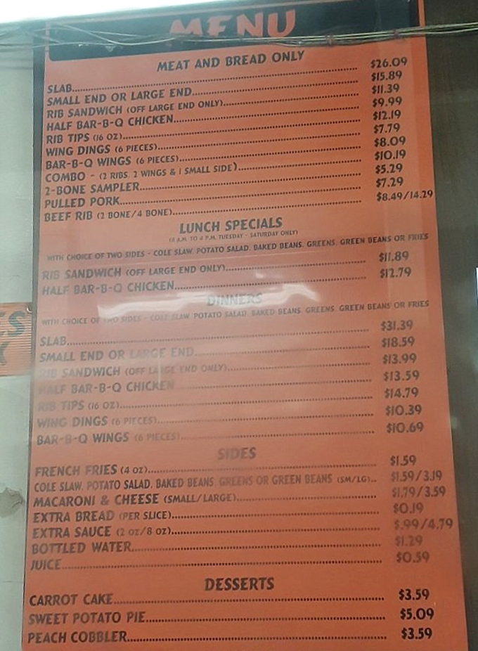 The menu board &ndash; a sacred text of smoked meat possibilities. Notice how "SLAB" sits at the top like the barbecue royalty it is.