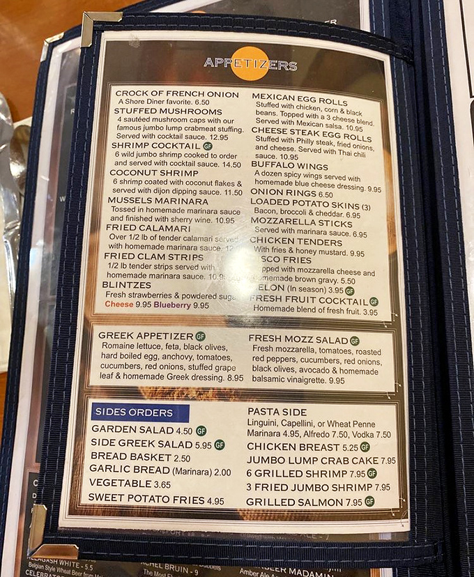 The menu reads like a love letter to comfort food classics. Each laminated page holds the potential for your next food memory.