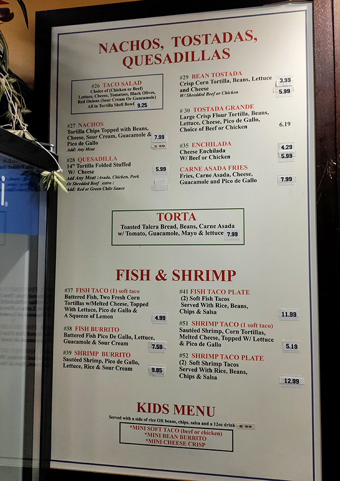 The menu board speaks a universal language: authentic Mexican comfort food without pretension or fusion confusion.