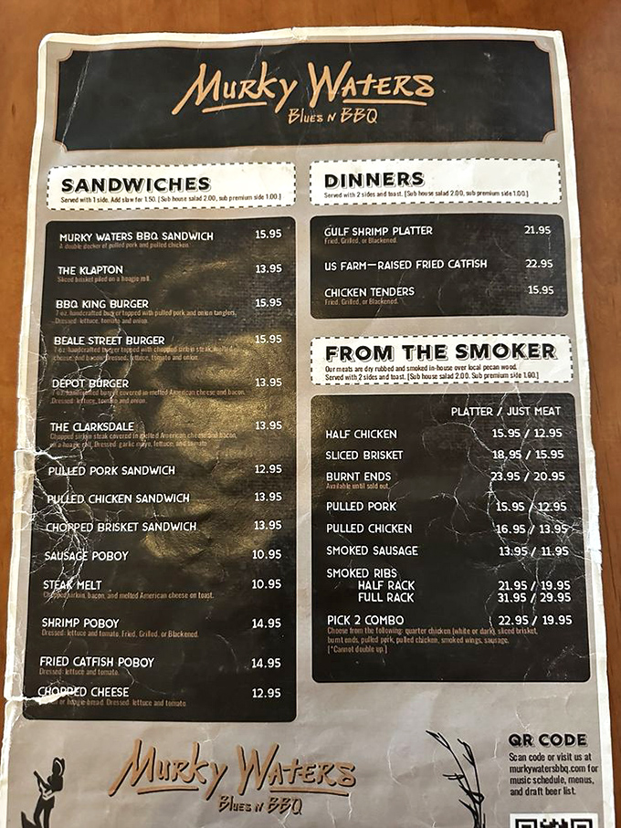 A menu that reads like a love letter to Mississippi's culinary geography. Each sandwich name tells a story of blues and barbecue.