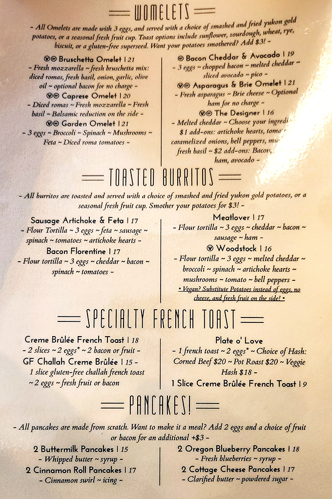 The menu reads like breakfast poetry—"Womelets" and toasted burritos that make deciding what to order life's most delicious dilemma.