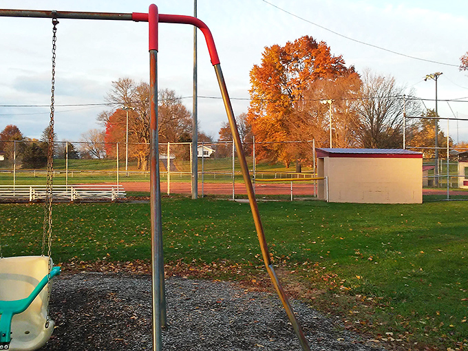 Autumn transforms the community park into a Norman Rockwell painting come to life &ndash; complete with that swing set that's probably older than your mortgage.