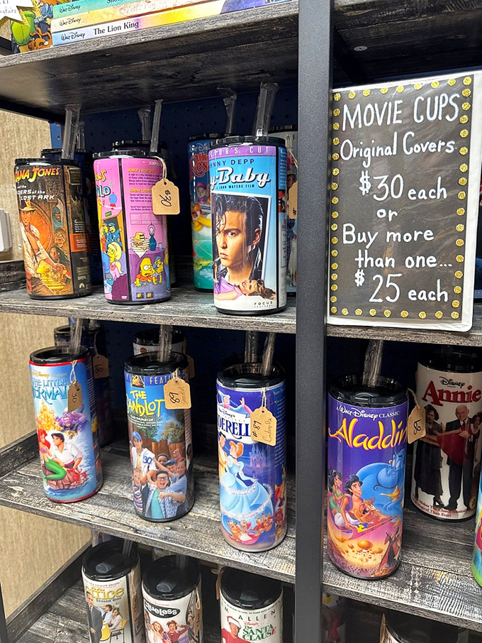 Remember when movie theaters sold these collectible cups? This nostalgic display has me reaching for my wallet and childhood memories simultaneously.