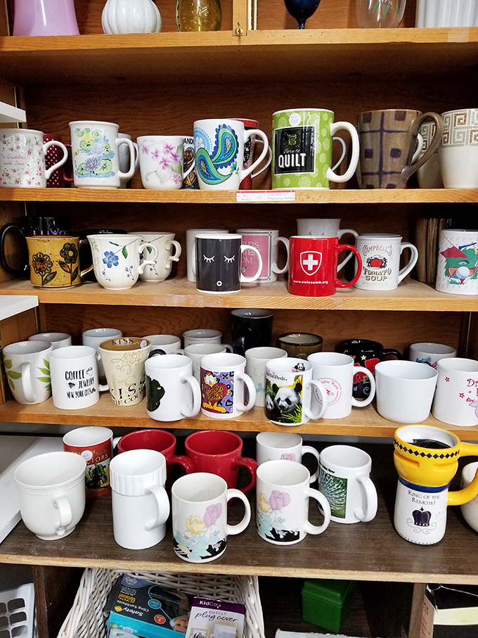 The mug wall &ndash; where coffee vessels retire to find second homes. That Swiss Red Cross cup has probably seen more of the world than most of us.