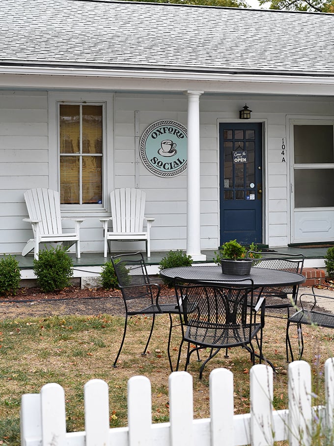 At Oxford Social, those Adirondack chairs aren't just furniture—they're an invitation to slow down and remember what conversation was like before smartphones.