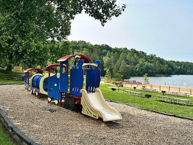This blue train playground might be for kids, but admit it&mdash;you're calculating if you could fit down that slide too.