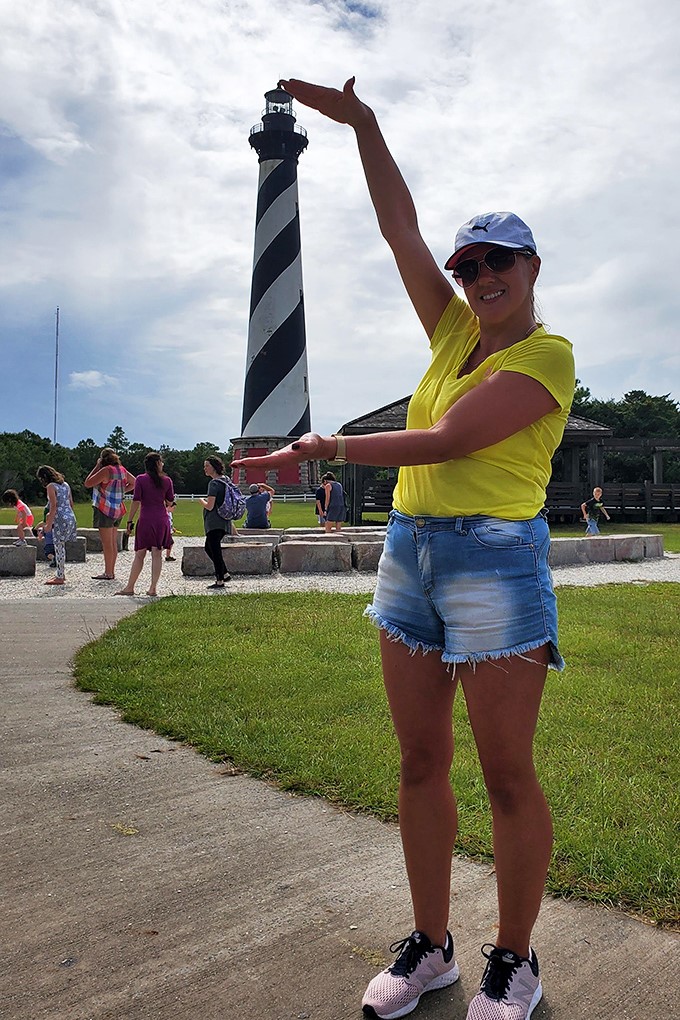 Capturing that perfect "I've got the whole lighthouse in my hands" perspective shot&mdash;a vacation photo tradition as timeless as the beacon itself.