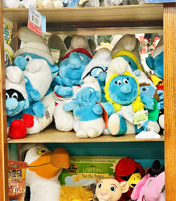 A village of Smurfs has taken up residence on this shelf, waiting to bring nostalgic joy to some lucky shopper's home.