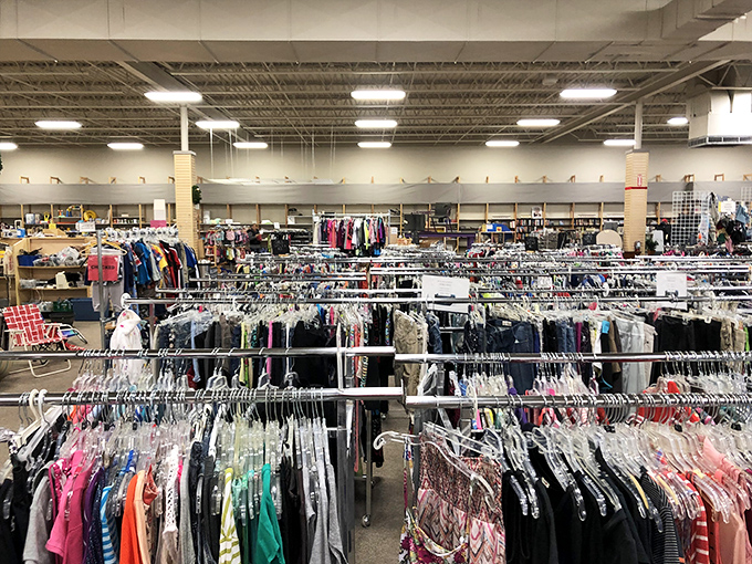 Racks upon racks of clothing create a textile landscape where yesterday's fashion finds tomorrow's admirers.