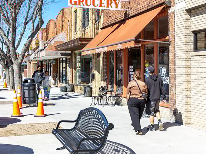 Main Street strolling: where "rush hour" means three people arrived at the grocery store simultaneously and everyone's politely deciding who goes first.