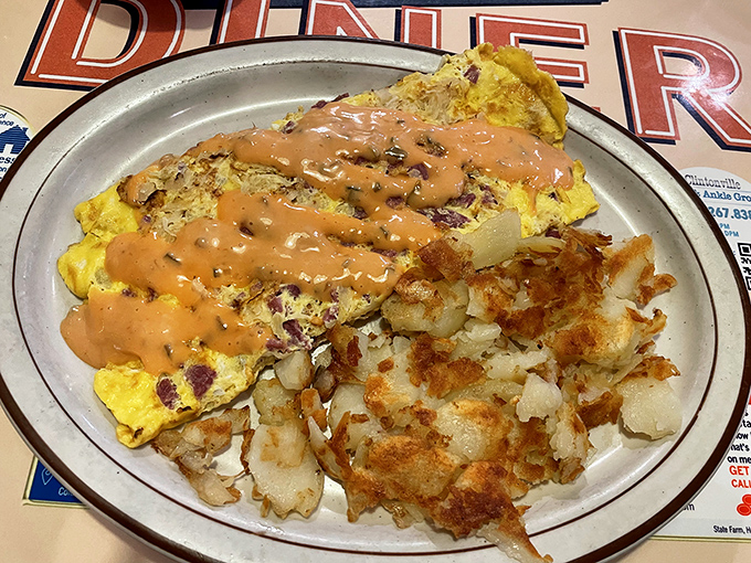 The legendary Reuben omelet in all its glory &ndash; where breakfast and lunch have a delicious identity crisis. Those home fries aren't just a side; they're a supporting actor deserving their own award.