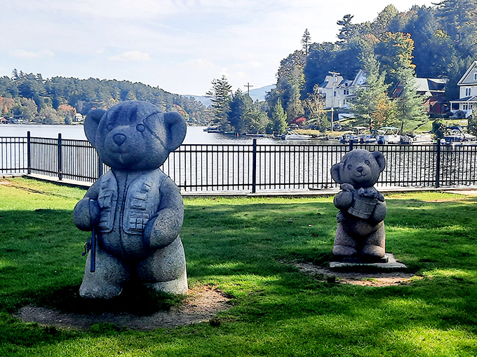 Even the teddy bears in Saranac Lake enjoy waterfront property. These stone guardians have seen more picnics and proposals than a wedding planner on overtime.