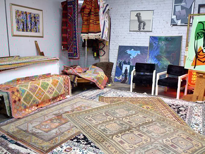 Textile heaven! These vibrant rugs and artworks transform concrete floors into a bohemian gallery space. Each pattern tells a different global story.