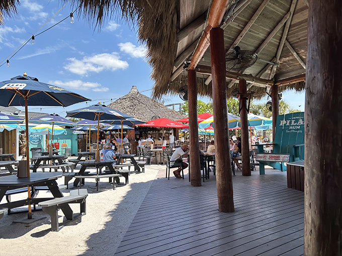 Beach bars like this aren't just serving drinks—they're selling a lifestyle. Tiki huts, colorful umbrellas, and toes-in-the-sand dining define Englewood's laid-back approach to enjoyment.