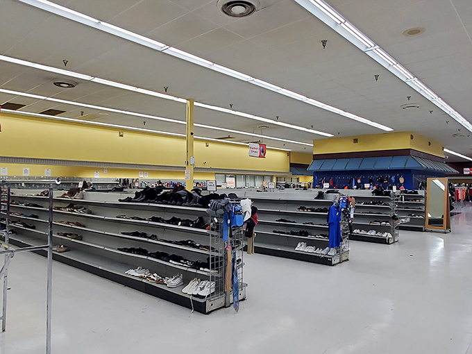 The shoe section stretches toward the horizon like a footwear library, each pair waiting to tell its next story with someone new.