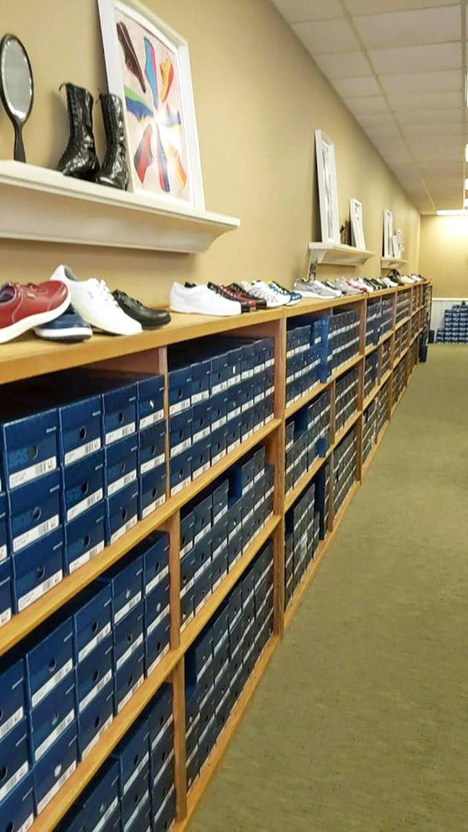Shoe heaven exists, and it has endless rows of blue boxes. Like a library of footwear possibilities, each shelf promising comfort and style.