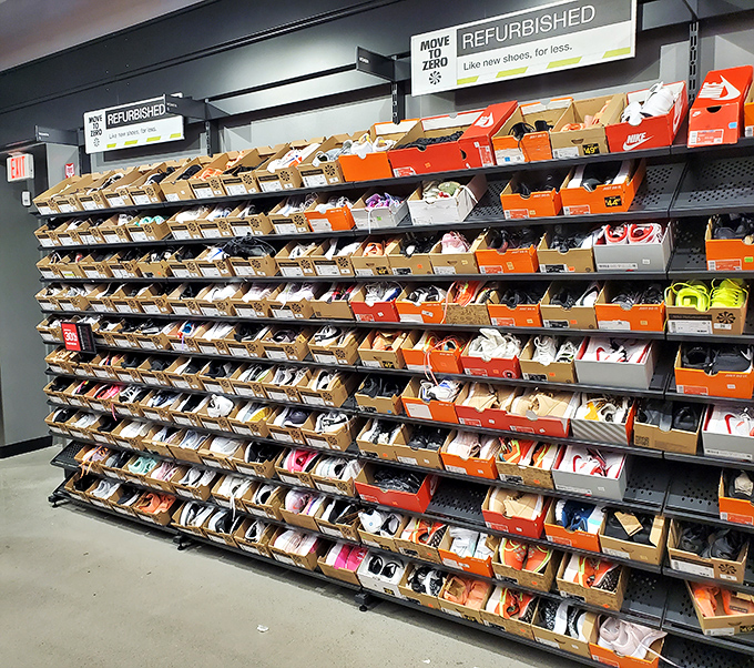 Sneaker heaven exists, and it's this wall of discounted footwear where shoppers contemplate which pair of the dozens will come home with them.