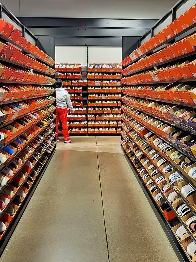 The promised land of footwear fanatics. Those iconic orange Nike boxes create a canyon of possibilities where sneaker dreams come true.