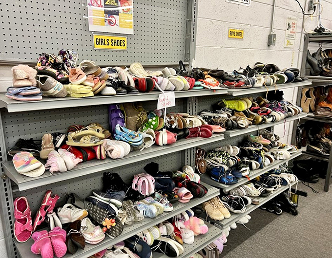 A kaleidoscope of footwear where hot pink sneakers mingle with sensible loafers, proving shoes really do have second acts.