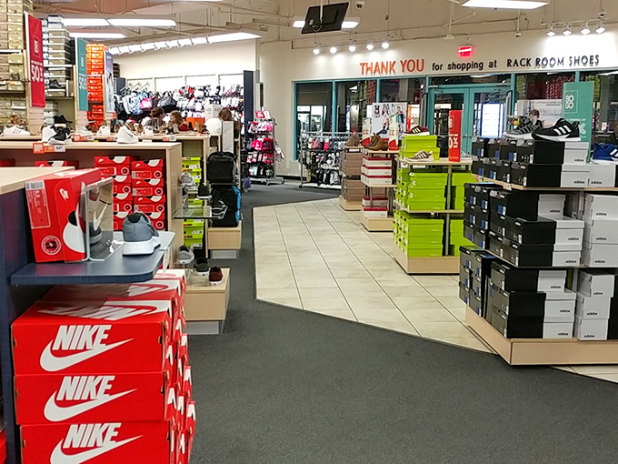 Sneakerheads, rejoice! Nike boxes stacked like a shrine to athletic achievement, with Rack Room Shoes offering footwear salvation for every budget.