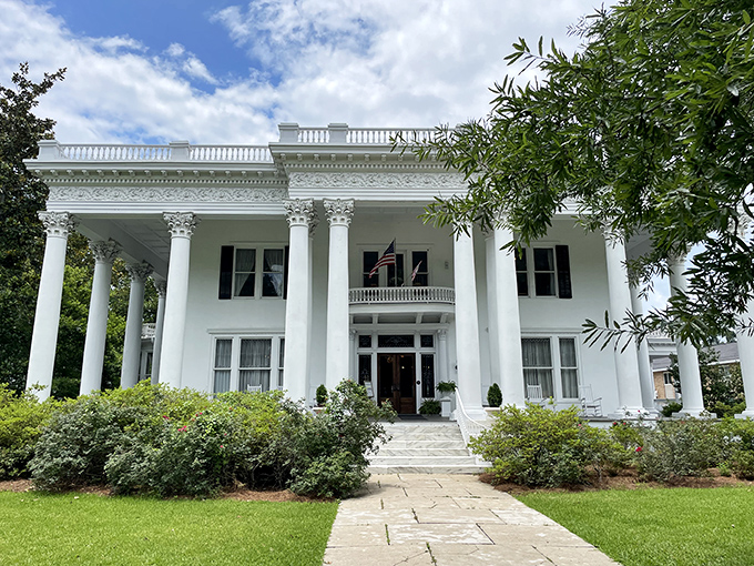 Shorter Mansion stands as a gleaming testament to antebellum architecture, its imposing columns practically daring you to find a more photogenic porch.
