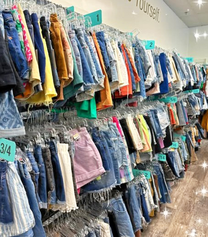 Denim heaven awaits with rows of jeans organized by size, making treasure hunting surprisingly civilized.