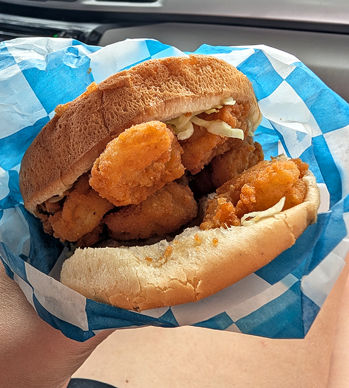 Behold the legendary shrimp burger in all its glory! Golden-fried local shrimp piled high on a soft bun with just enough slaw to make your taste buds dance.
