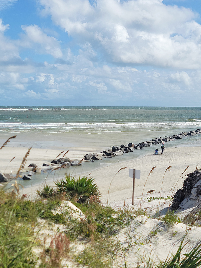 Where sky meets sea at Smyrna Dunes Park. Those tiny figures on the jetty aren't measuring the distance to Cuba&mdash;they're measuring their good fortune. 