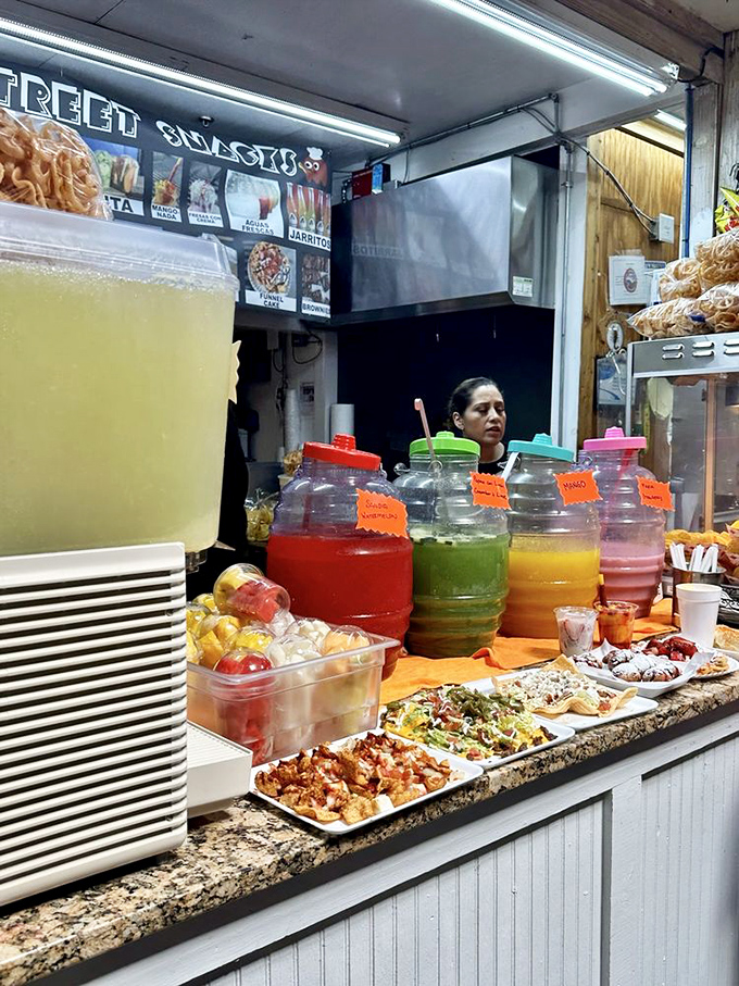 Colorful aguas frescas lined up like a liquid rainbow, ready to refresh you between hunting for bargains and discoveries.