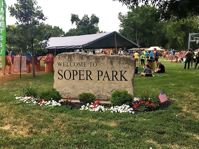 Soper Park welcomes visitors with a stone entrance that promises community gatherings where neighbors become friends without emptying wallets.