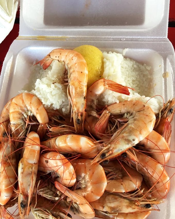 These plump, glistening shrimp nestled on rice aren't just food; they're edible postcards from paradise that say "Wish you were here eating this!"