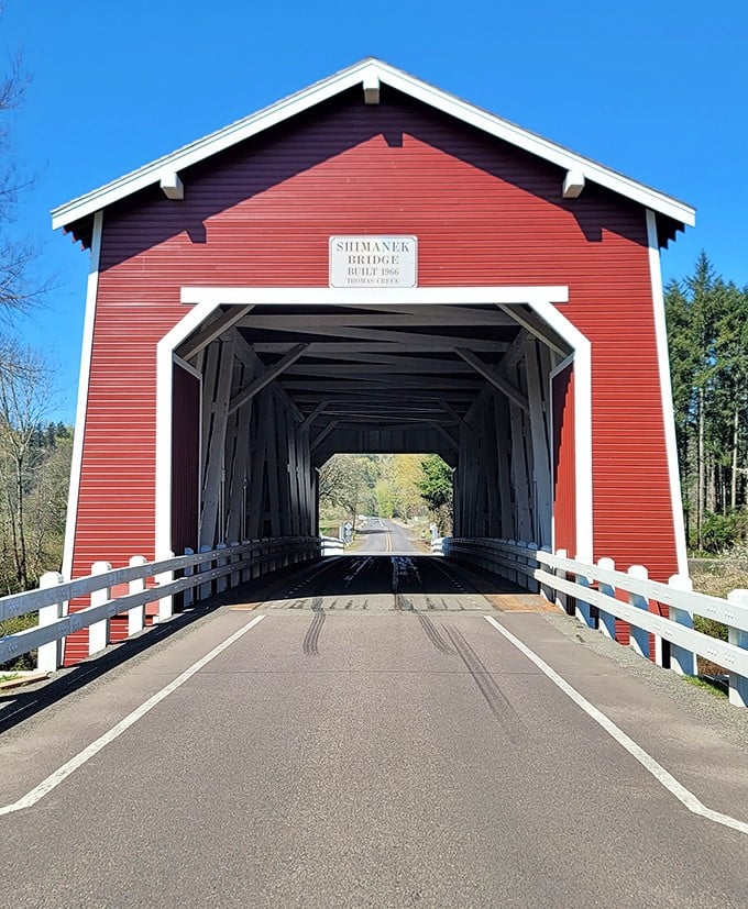 The bridge's distinctive red siding and white trim create a picture-perfect portal to the past. No Instagram filter needed for this authentic slice of Americana.