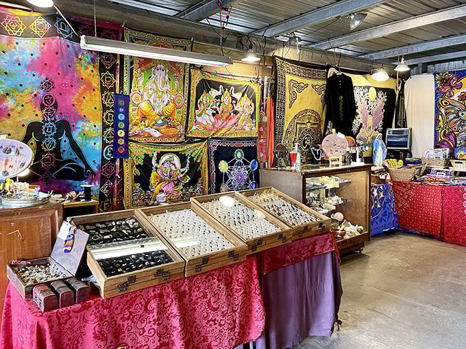 A kaleidoscope of color and culture! This vendor's tapestry collection transforms shopping into a spiritual treasure hunt complete with jewelry displays that sparkle with possibility.