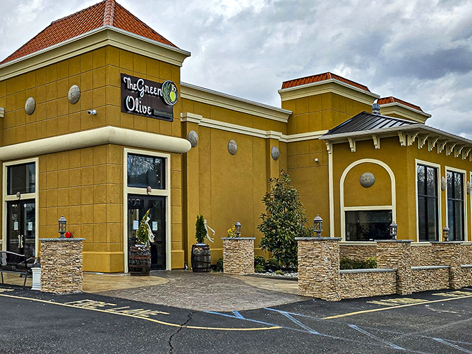 The Green Olive stands as a Mediterranean oasis amid South Jersey landscapes, its warm ochre walls and stone accents promising culinary adventures beyond typical diner fare.