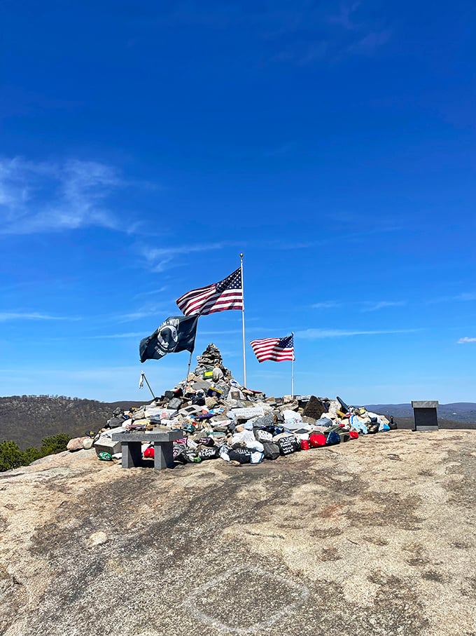 A summit tribute that speaks volumes. Hikers add stones to this memorial, proving that sometimes the most meaningful monuments are built one small gesture at a time.