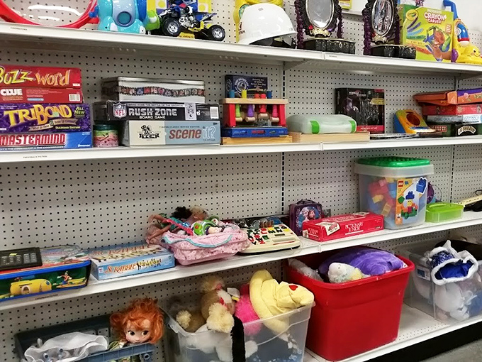 Board games, action figures, and childhood memories line these shelves &ndash; one person's outgrown toy is another's nostalgic treasure or child's next obsession.