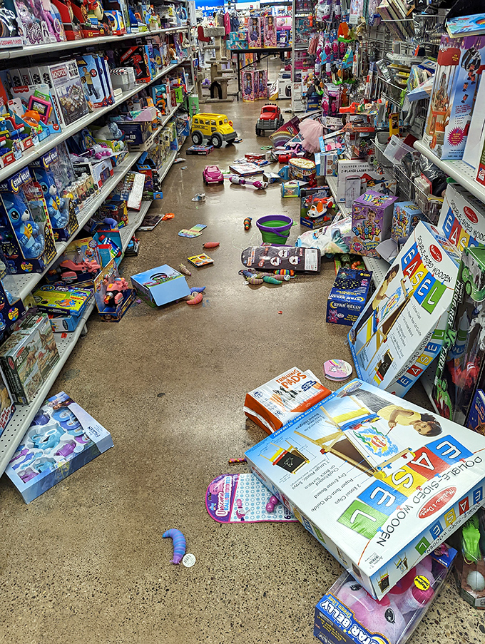 The toy aisle after a tiny tornado of excitement—evidence that bargain hunting is a family affair at Gabe's.