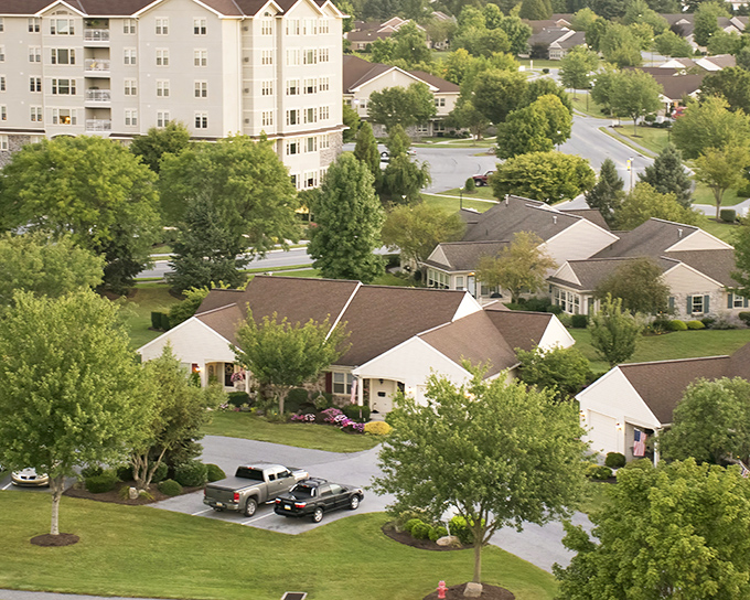 The Village Square Apartments rise above the community like a cruise ship that wisely decided to dock permanently in Pennsylvania Dutch Country.