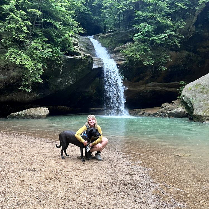 Four-legged hiking companions often steal the show at Cedar Falls. This pup clearly understands the assignment: pose dramatically, upstage the waterfall.