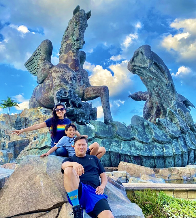 Nothing says "Florida family vacation" quite like posing with a colossal winged horse locked in eternal combat with a dragon.