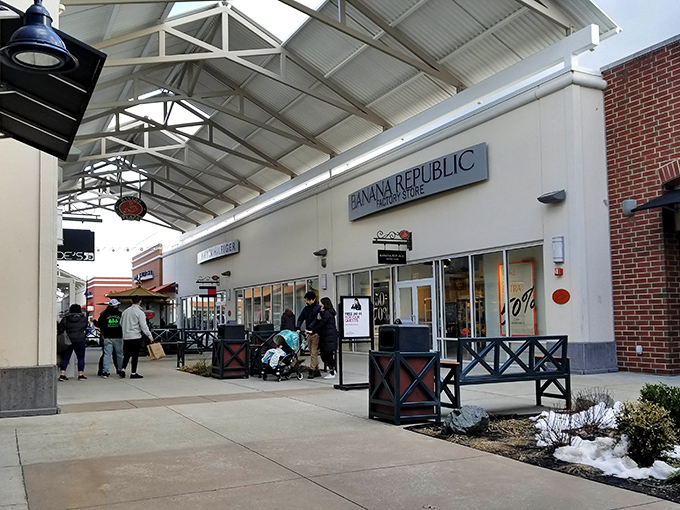Banana Republic Factory Store beckons with promises of workplace chic at weekend-friendly prices. The covered walkway means neither rain nor snow shall impede the quest for deals.