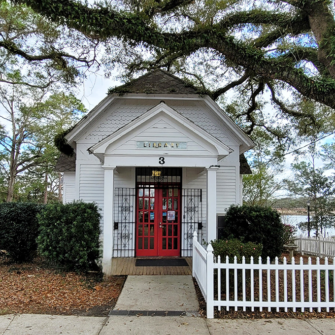 This charming library with its vibrant red door isn't just adorable &ndash; it's a literary oasis where stories and history mingle under the watchful gaze of ancient oaks.
