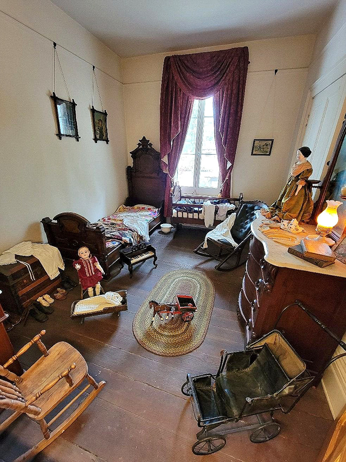 Victorian childhood meets period furniture in a room that feels frozen in time, toys and all.