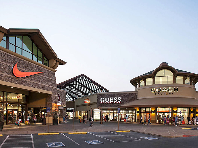 The retail trifecta: Nike, Guess, and Coach standing shoulder-to-shoulder like old friends conspiring to make your wallet significantly lighter.