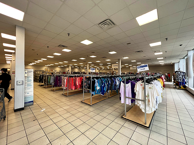 Racks upon racks of possibility! The clothing section stretches out like a textile sea, organized by type and size for easy navigation.