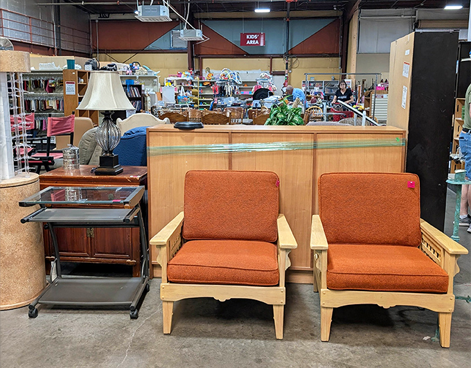 Mid-century modern meets vintage chic in the furniture section, where those orange-cushioned chairs are just waiting to tell stories in someone's living room.