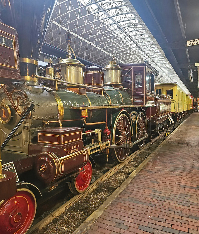 Museum treasures gleam under skylights, where polished brass and mahogany tell stories of an era when travel was an occasion worth dressing up for.