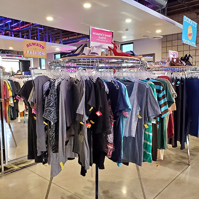 Treasure hunters navigate a sea of organized chaos, where designer gems hide among everyday finds like culinary truffles in forest soil.