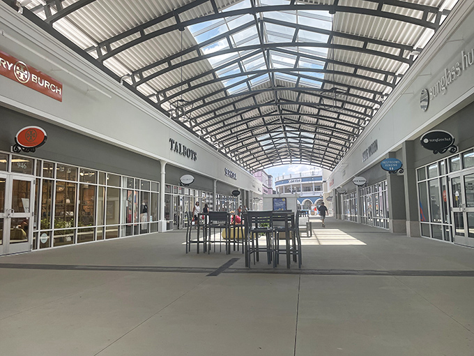 Sunlight streams through skylights in this covered walkway, creating a climate-controlled treasure hunt between Tory Burch and Talbot's without the typical mall claustrophobia.